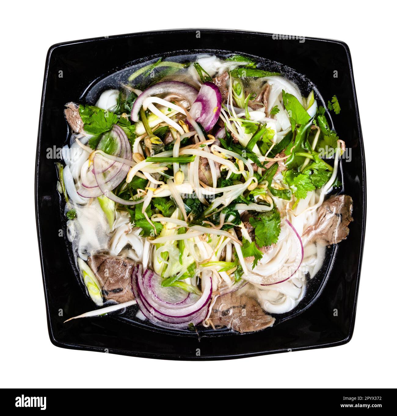 top view of Vietnamese Soup Pho Bo with rice noodles, broth, onion ...