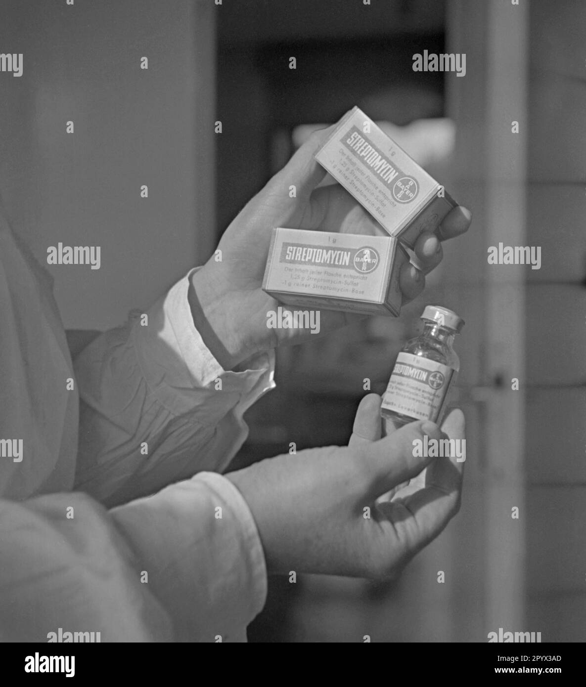 Shown are the packaging and glass of the antibiotic streptomycin from ...