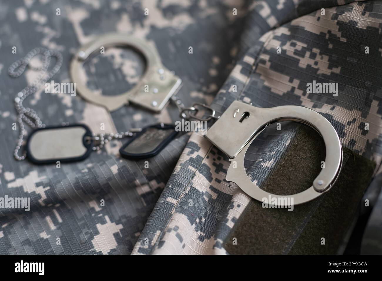 military camouflage uniform, handcuffed on background Stock Photo - Alamy