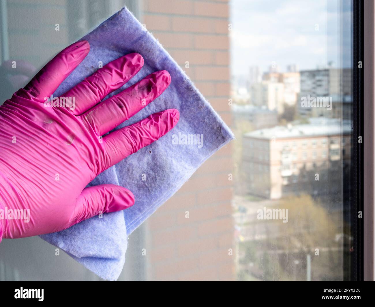 Wiping glass pink wipe hand hi-res stock photography and images - Alamy