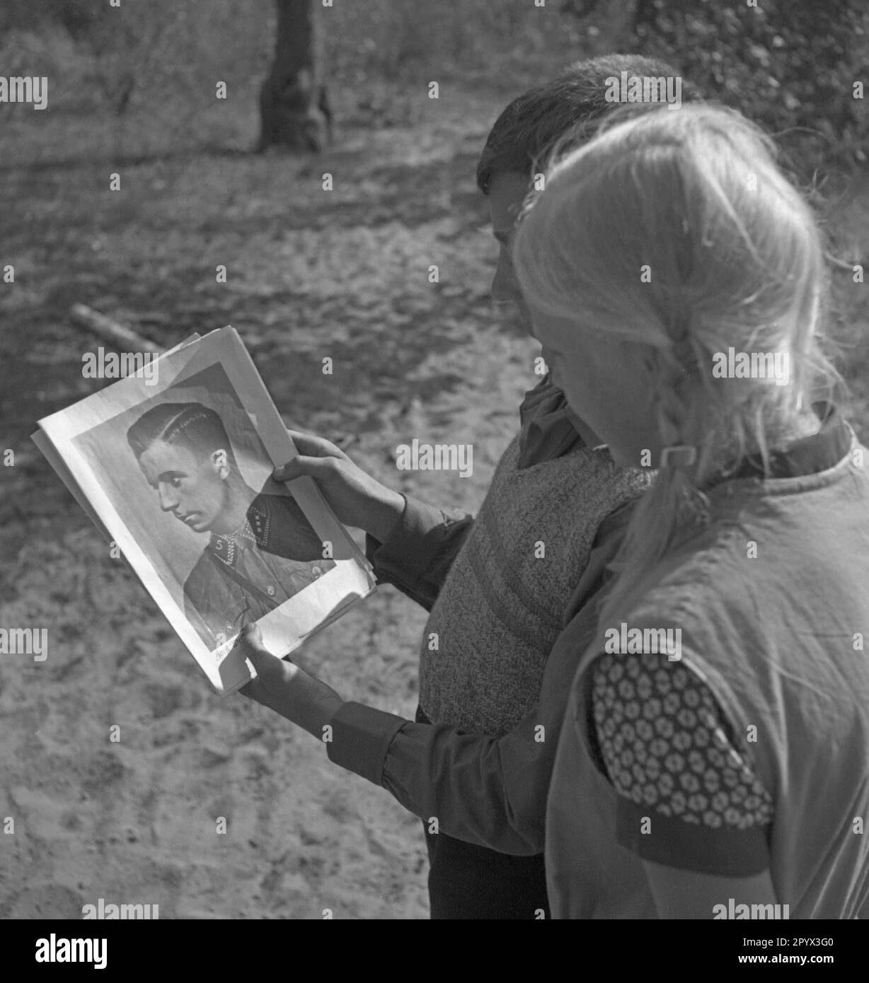 Children on the Baltic island of Ruden look at a portrait of Horst ...