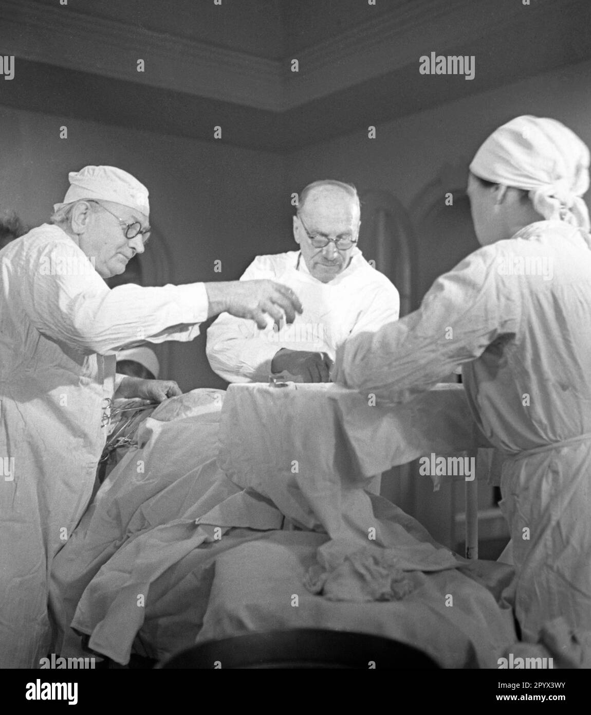 Professor Ferdinand Sauerbruch (center) and Julius Jungbluth (left ...
