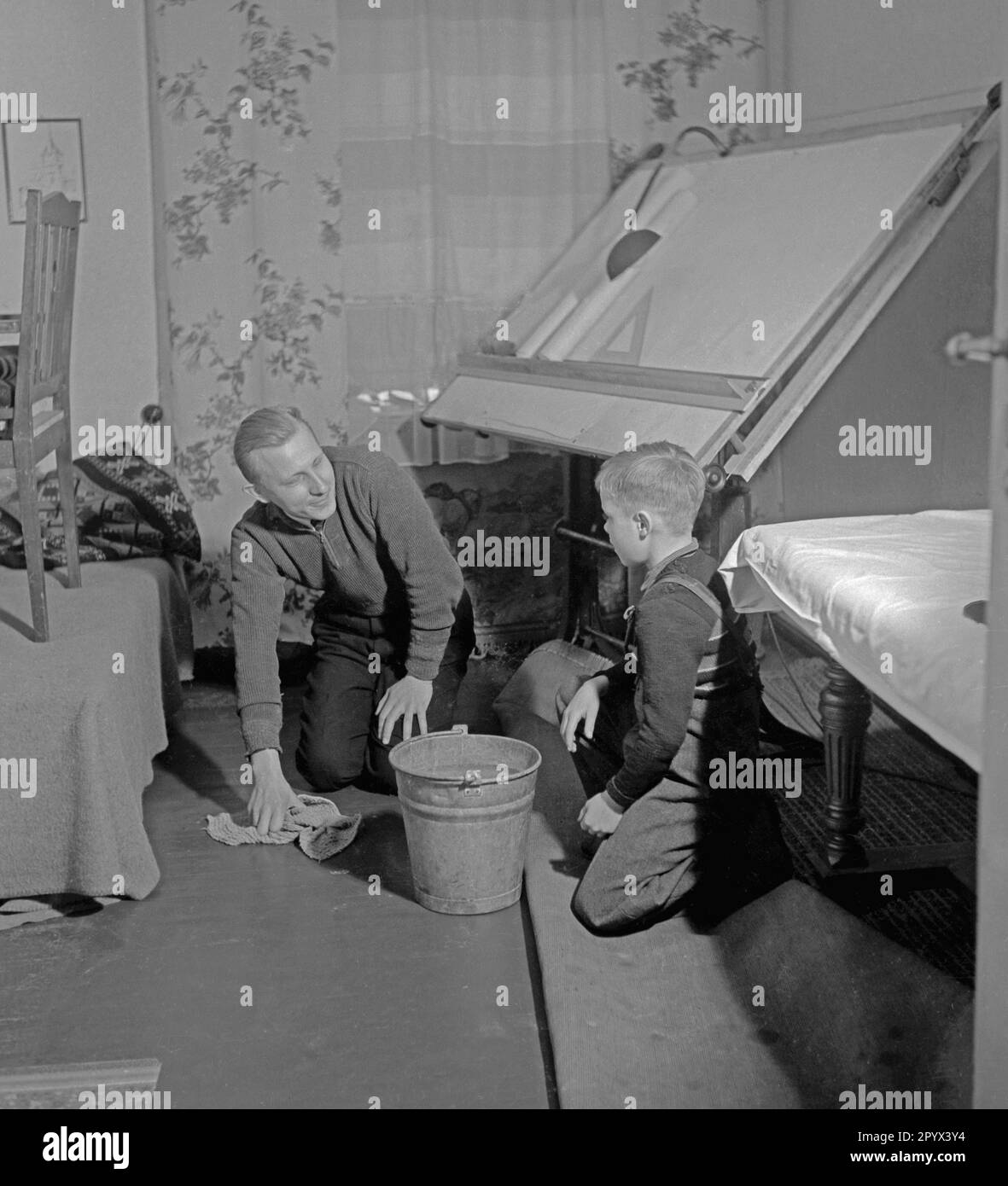 Father kneeling Black and White Stock Photos & Images - Alamy