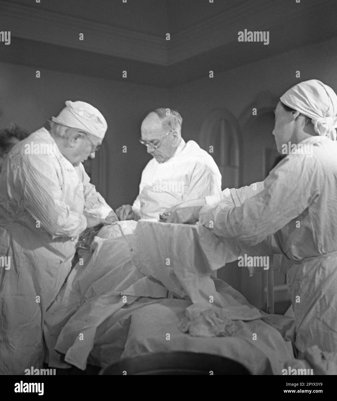Professor Ferdinand Sauerbruch (center) and Julius Jungbluth (left ...