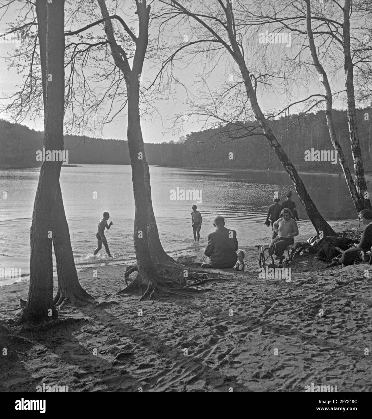 Two men in sand Black and White Stock Photos & Images - Alamy