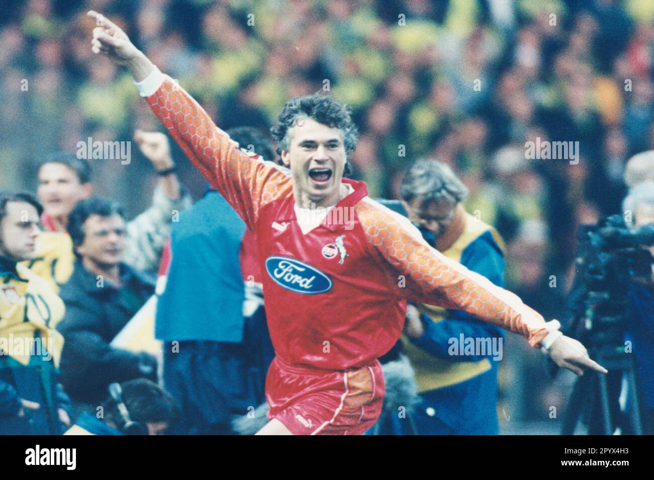 Toni Polster, 1 FC Köln, celebrates one of his three goals in the match ...