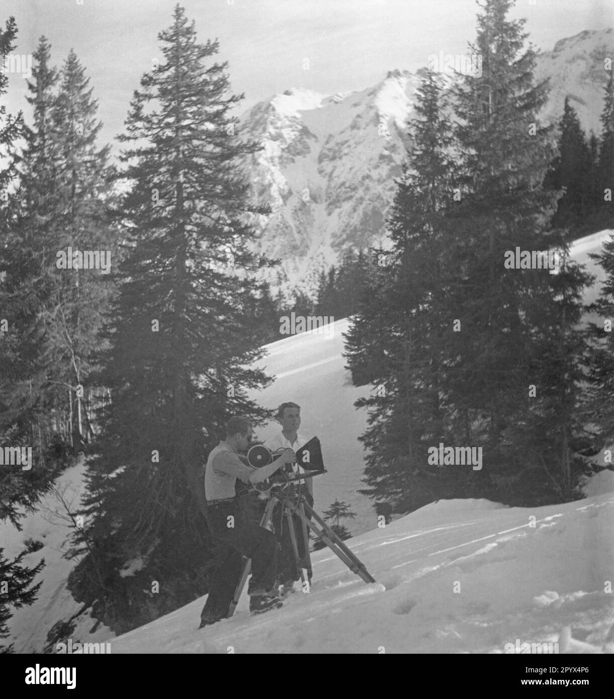 "Two cameramen are filming on a high alpine pasture at a recreation ...
