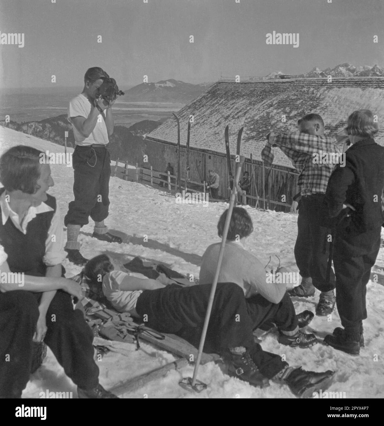 "People taking a break on a high alpine pasture at a recreation home of ...