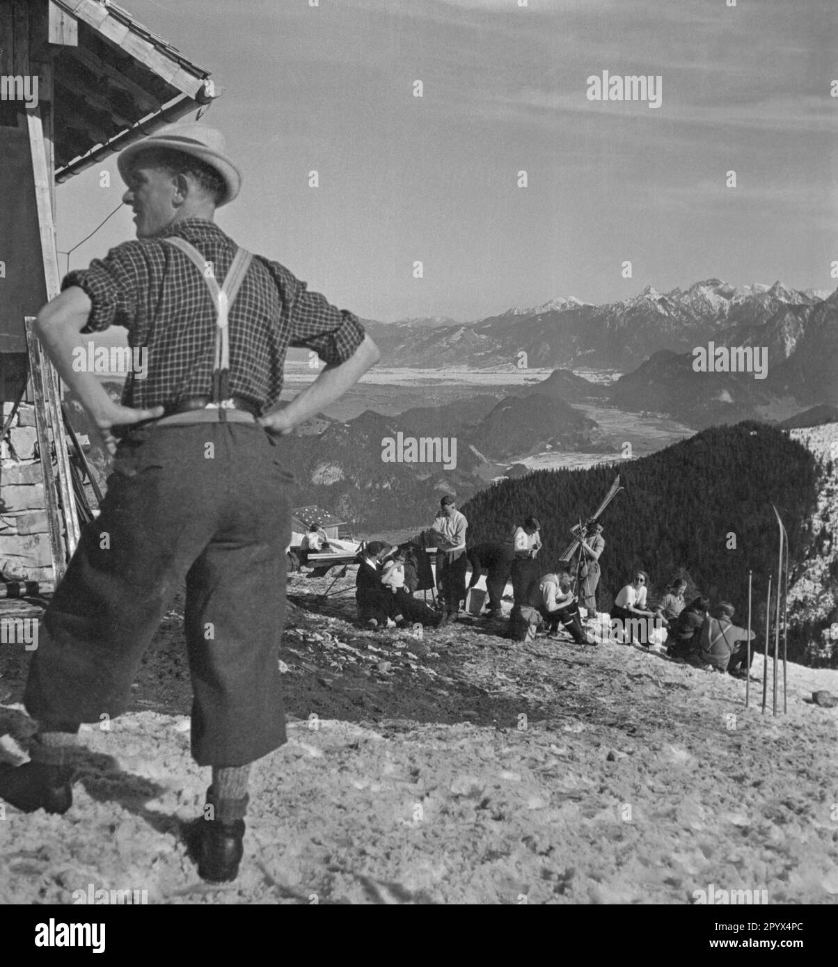 "People taking a break on a high alpine pasture at a recreation home of ...