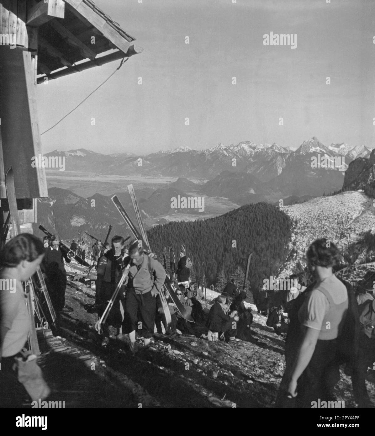 "People taking a break on a high alpine pasture at a recreation home of ...