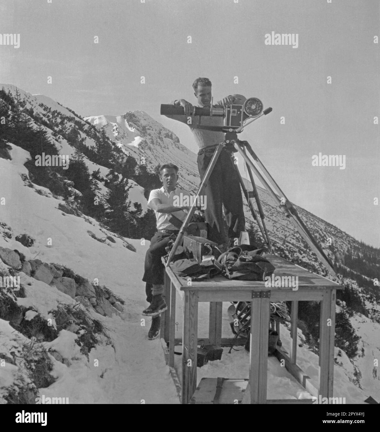 "A cameraman films on a podium on a high alpine pasture at a recreation ...