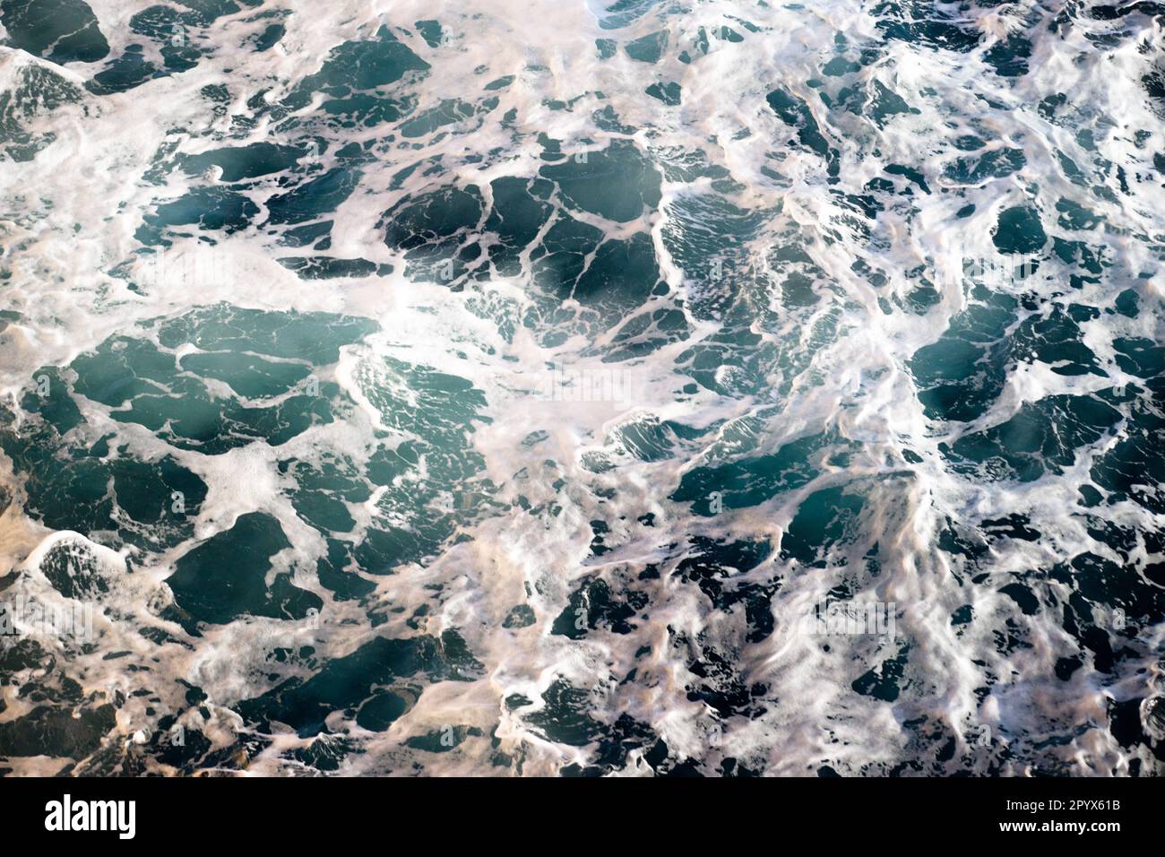 Blue waves, white sea foam background Stock Photo - Alamy