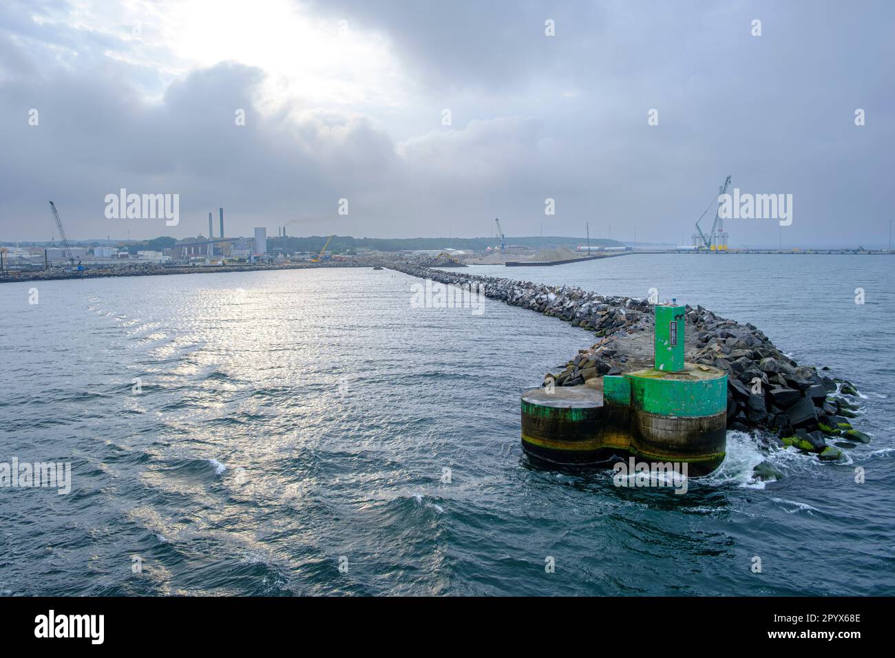 Entrance to the ferry port of Sassnitz Mukran with lighthouse and pier ...