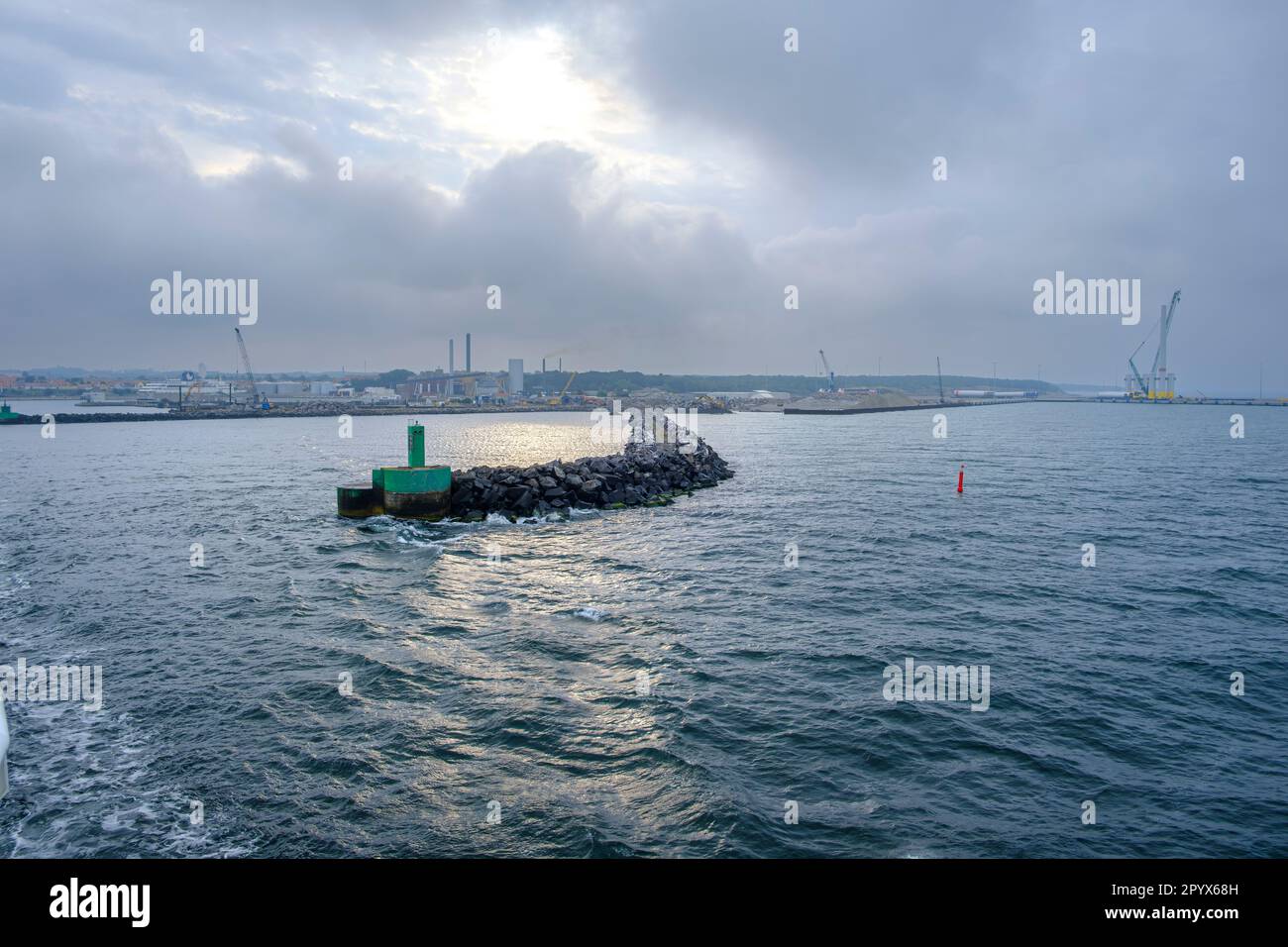Entrance to the ferry port of Sassnitz Mukran with lighthouse and pier ...