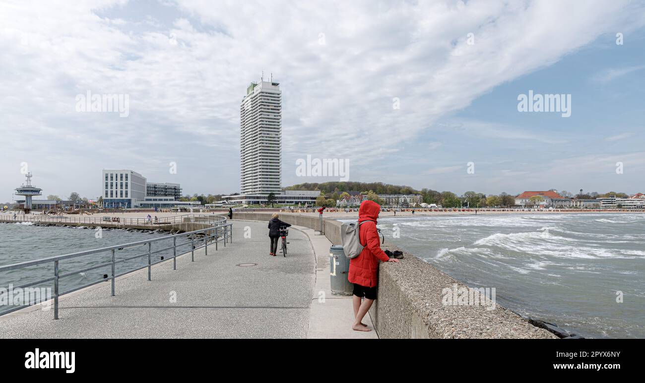 06 May 2023, Schleswig-Holstein, Travemünde: A woman looks at the ...