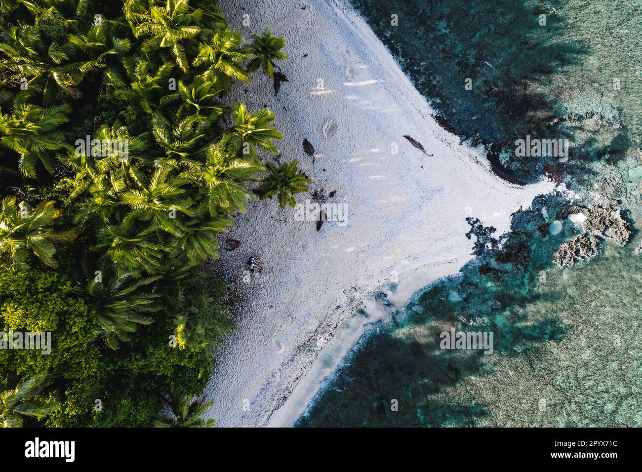 An aerial view of a stunning beach on the island of Guam, with an ...