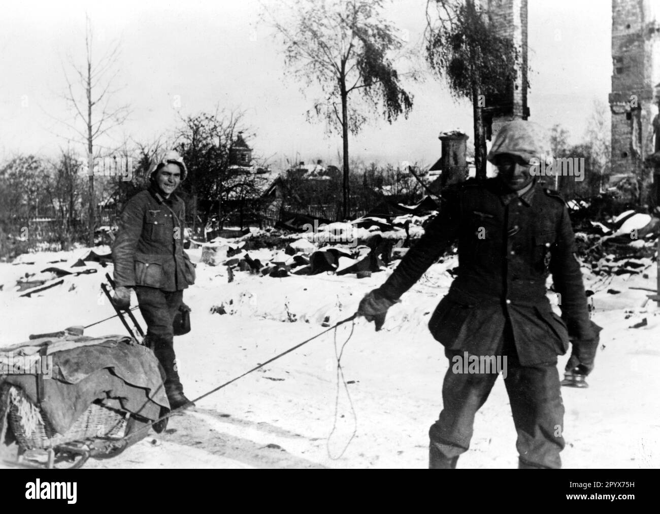 German soldiers transporting material on a sled near Lagola. Photo ...