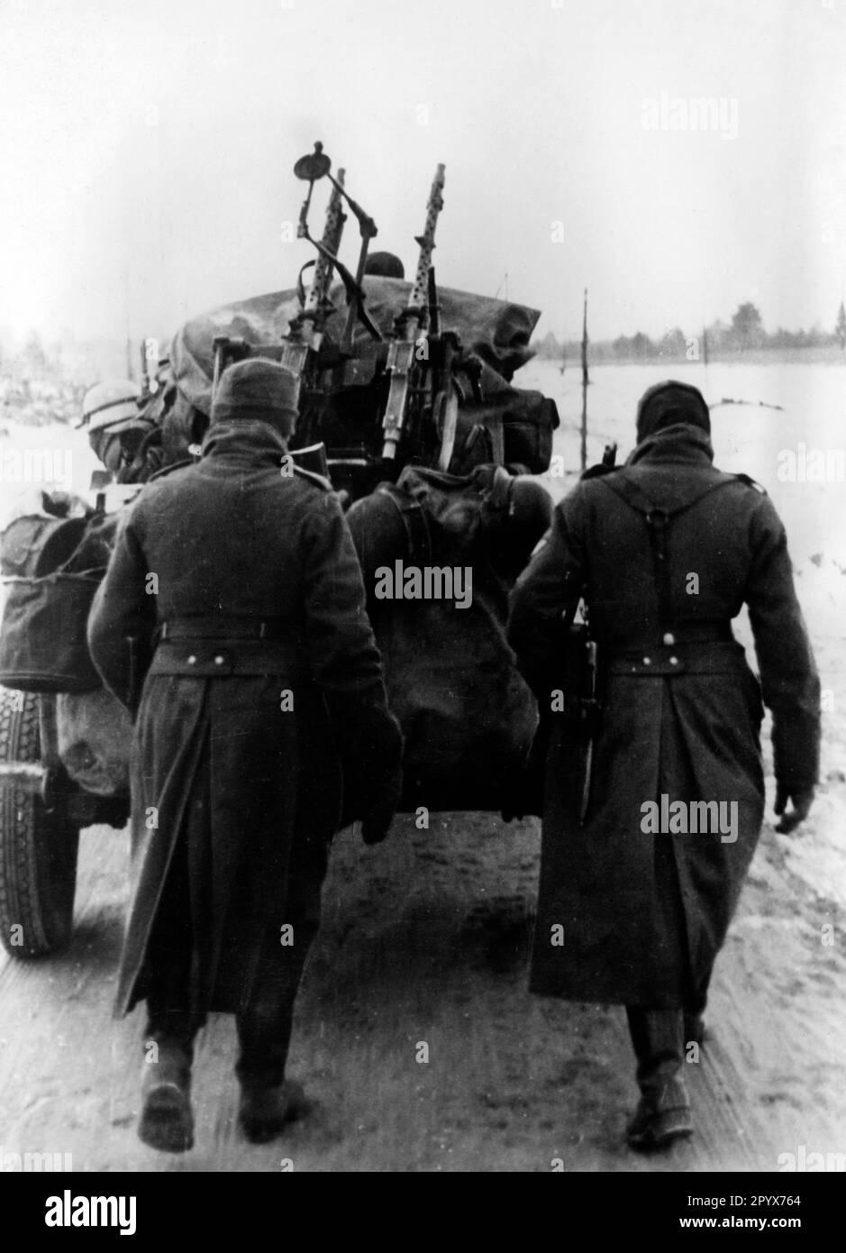 German troops on the march with an anti-aircraft gun on a double mount ...