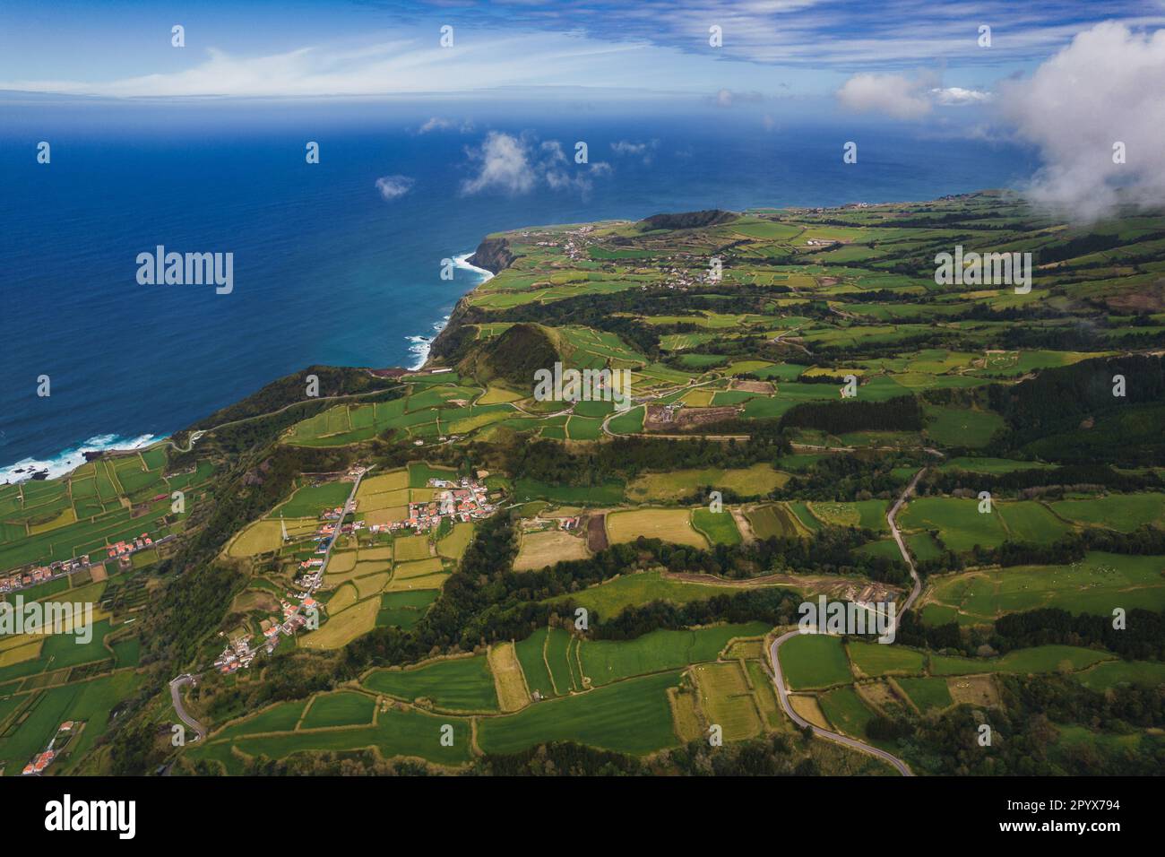 Aerial view of the coastline on Sao Miguel Island, with town buildings ...