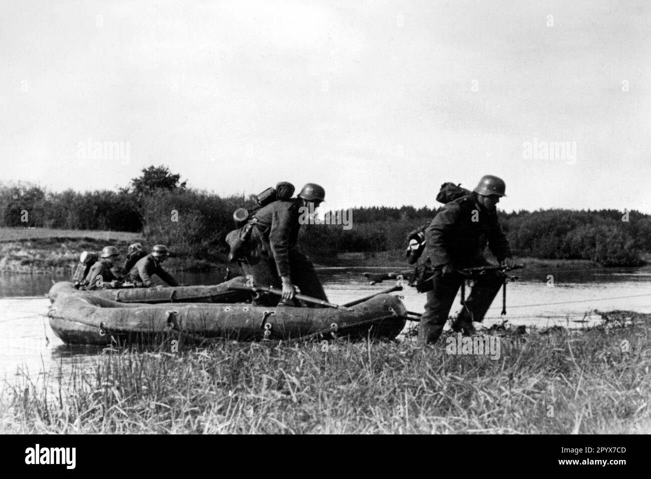 German soldiers set a raft bag across the Betma near Chukowka just ...