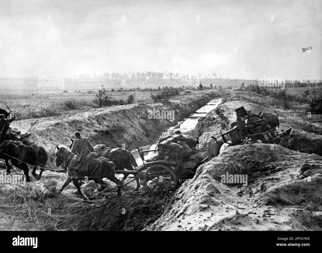 German horse-drawn carriage crossing a passable Russian tank ditch ...