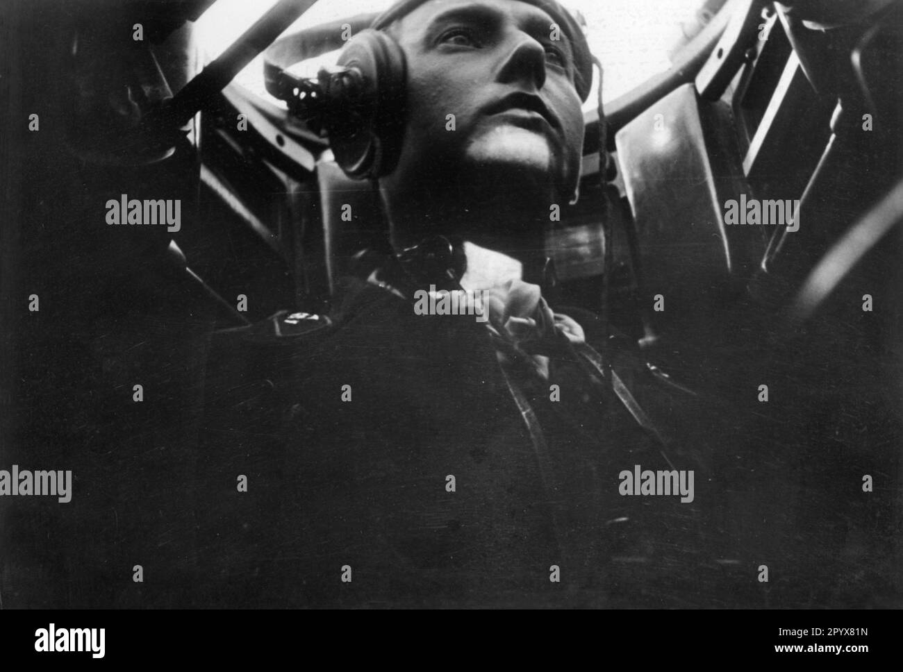 Tank commander in the commander's cupola of his battle tank during a ...