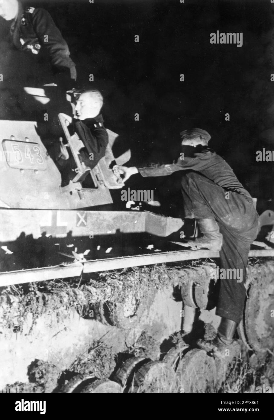 Tank crew mounts their tank near Vyazma in the central section of the ...