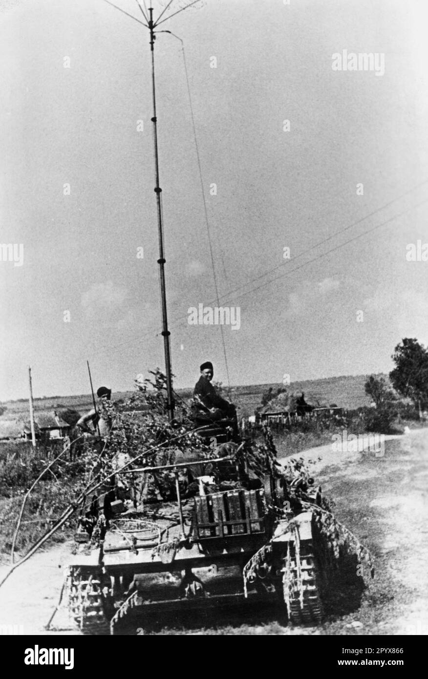 A commander's Panzer III command vehicle with a radio antenna widely ...