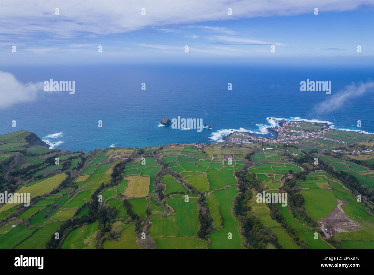 Aerial view of the coastline on Sao Miguel Island, with town buildings ...