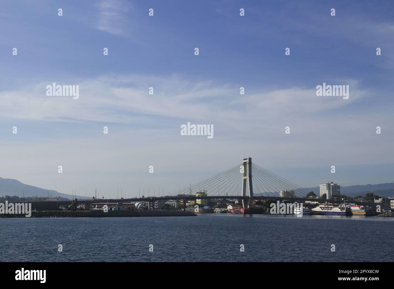 View of the city of Manado in Indonesia from the sea. You can see the ...