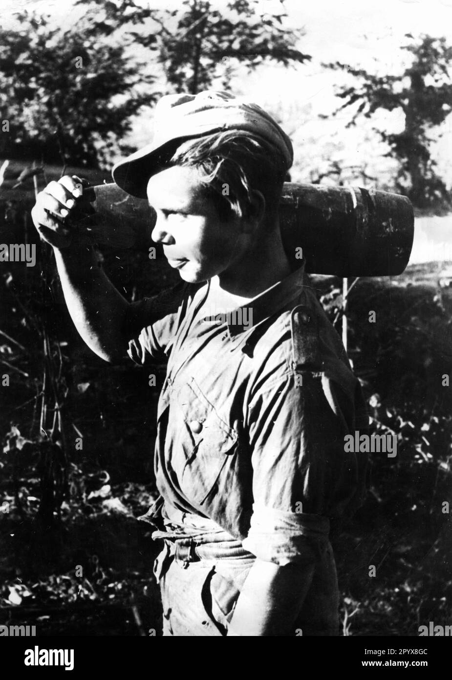 A young soldier as a gunner in an artillery battery, probably on the ...
