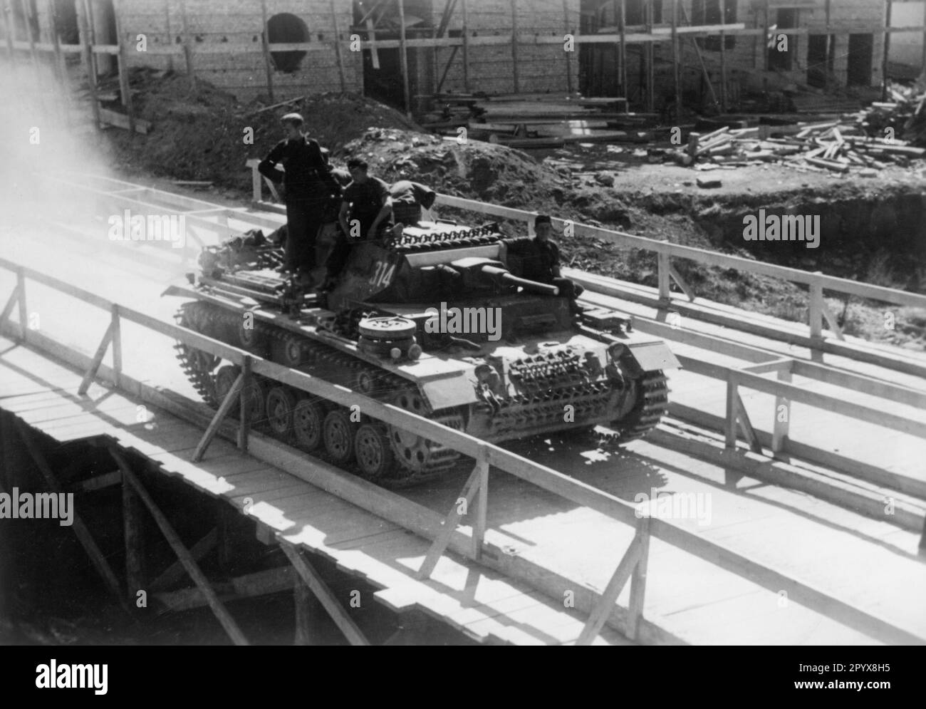 A German Panzer III crosses an engineer bridge at Rossitten in present ...