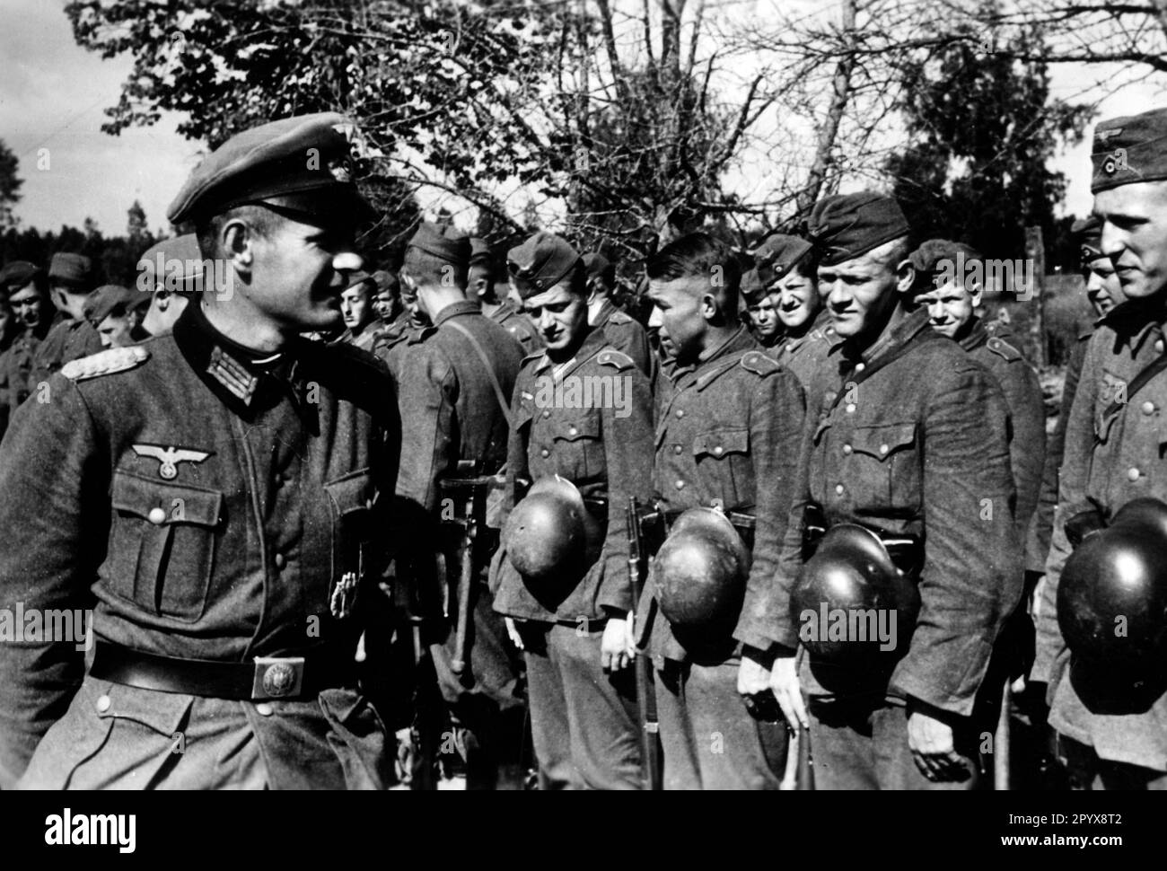 A battalion commander, a major, inspects soldiers freshly arrived at ...