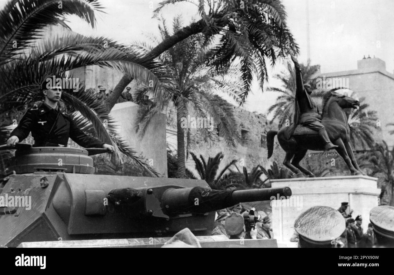 A soldier of the Panzertruppe on a Panzerkampfwagen III in front of the ...