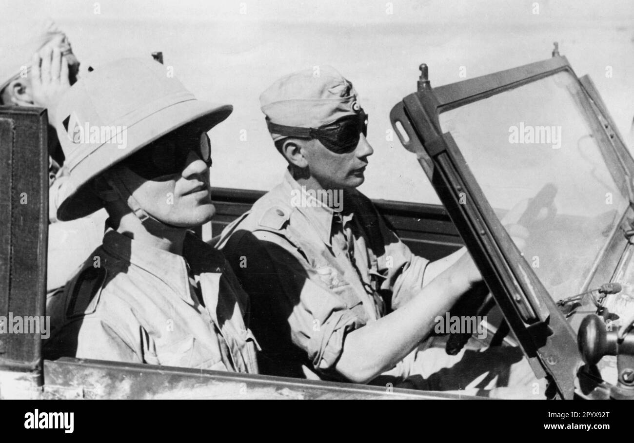 Soldiers of an air force unit of the German Afrika Korps sit in a motor ...