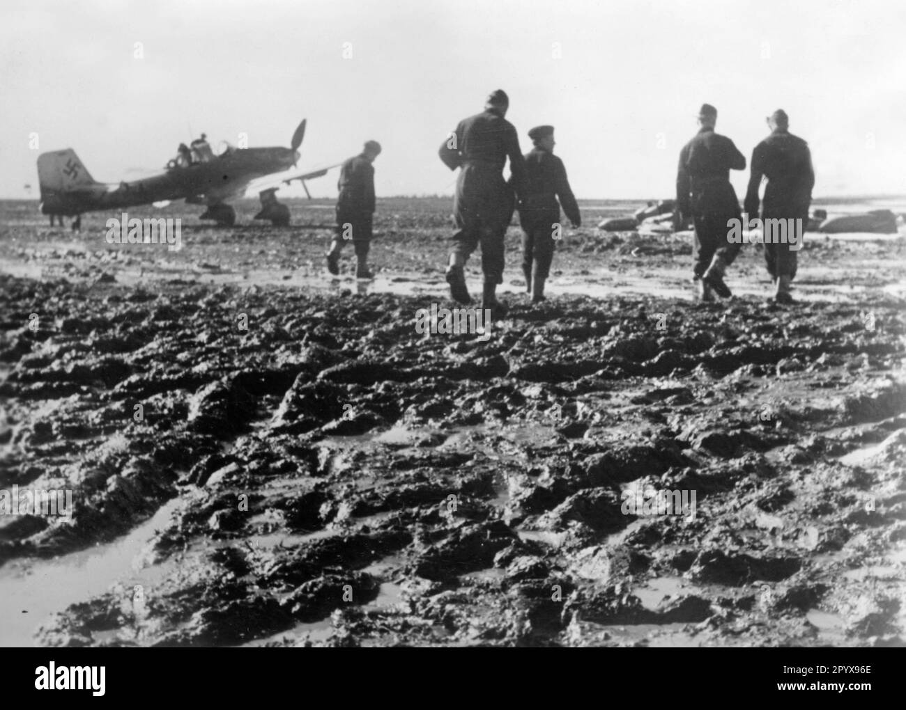 Junkers Ju 87 on an airfield whose surface has been turned into a mud ...