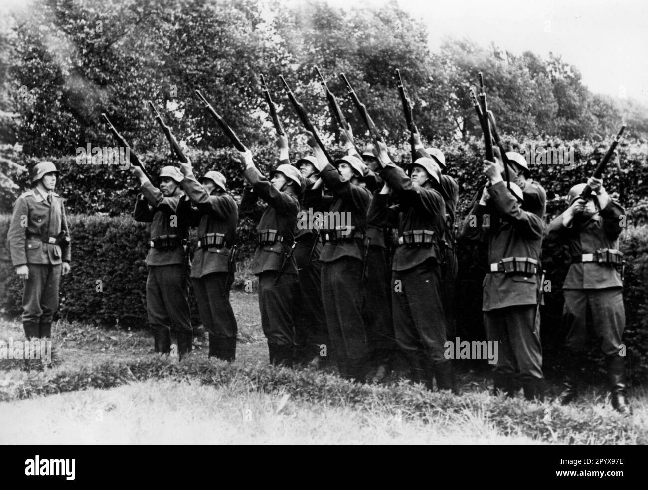 A German Air Force honor formation at the funeral of a British pilot at ...