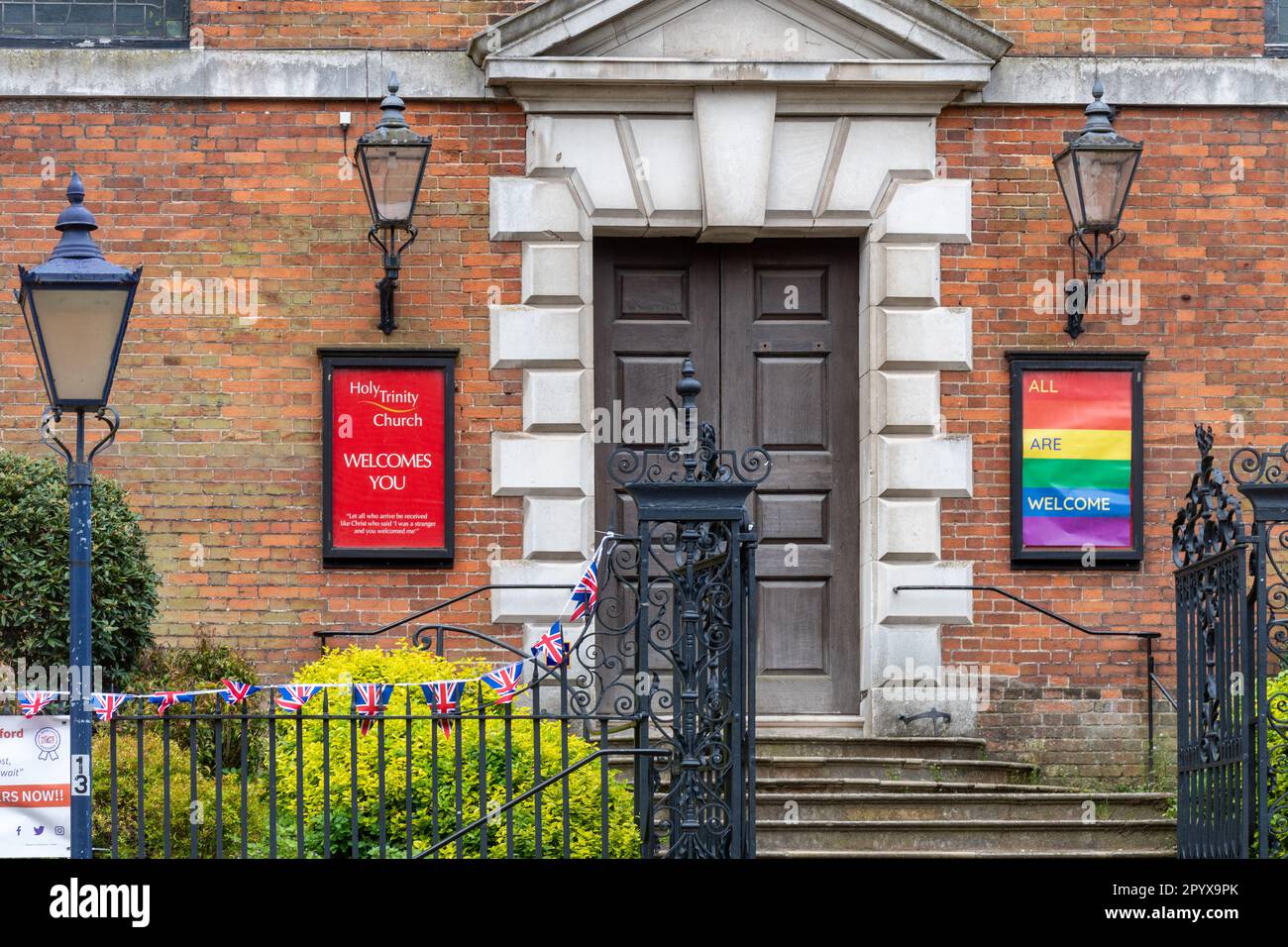 Rainbow sign outside a church stating All Are Welcome, Guildford ...
