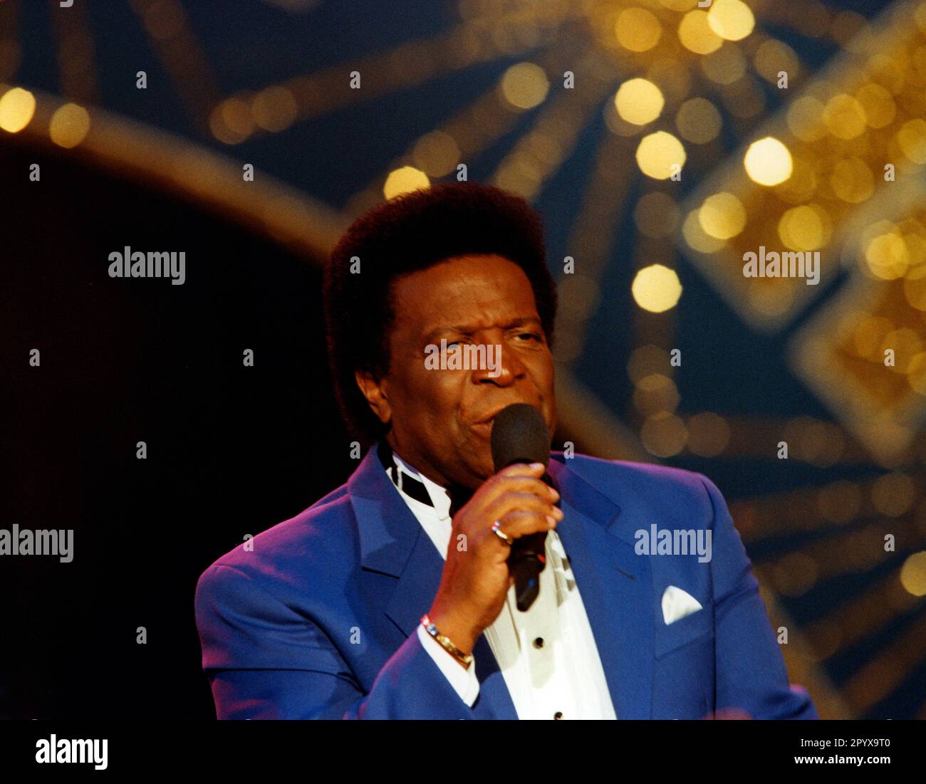Singer Roberto Blanco on stage Stock Photo - Alamy