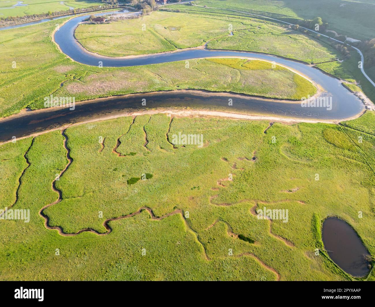 aerial views of the meanders of the cuckmere river in the south downs ...