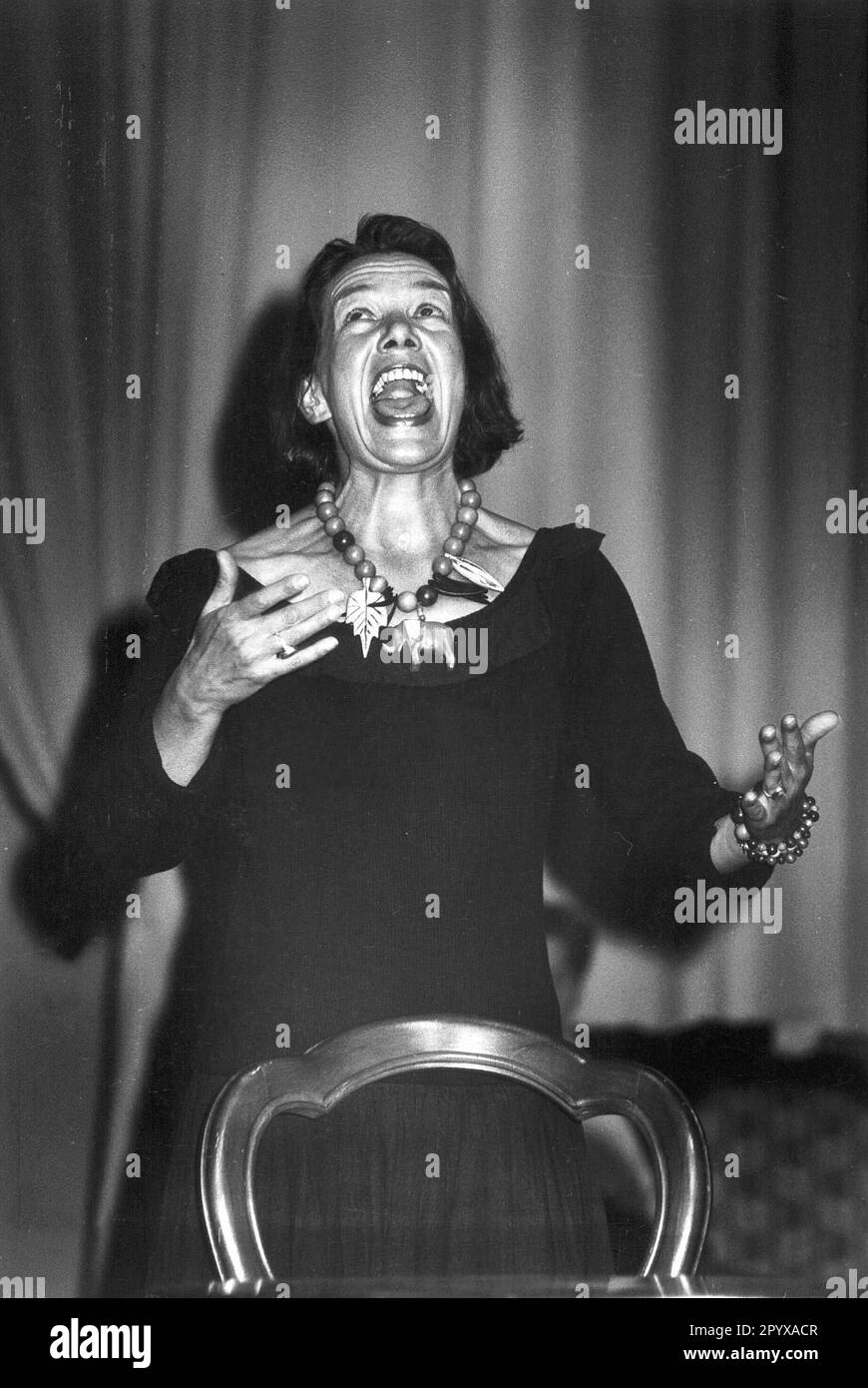 Man in fear: Woman screaming in fear or having a hysterical fit ...