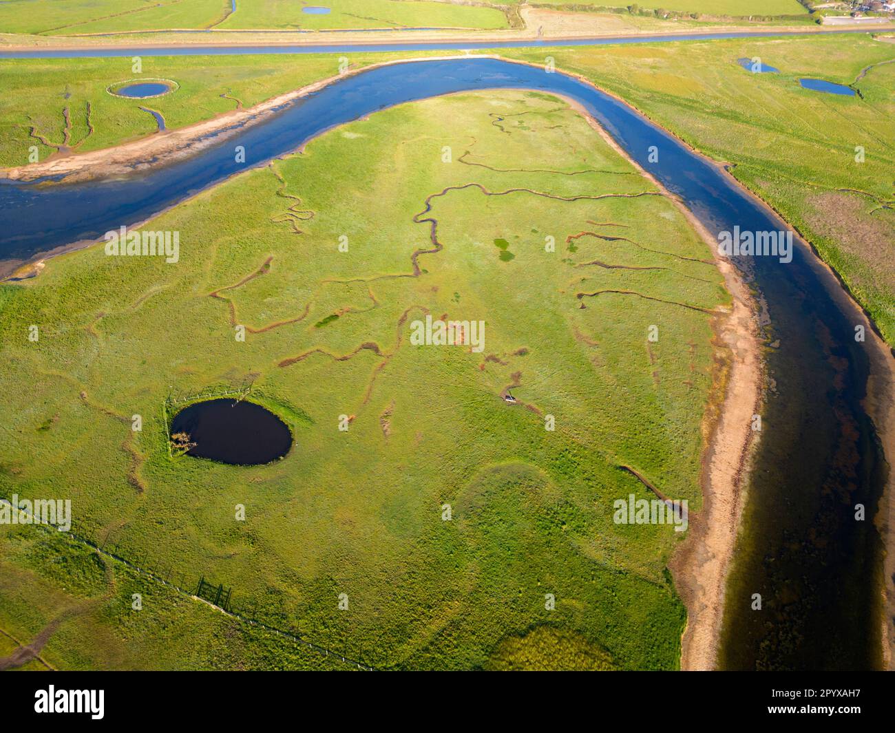 aerial views of the meanders of the cuckmere river in the south downs ...