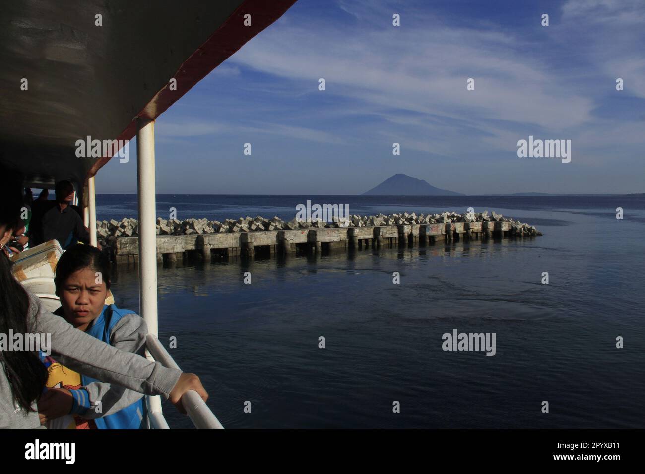 Part of a passenger ship approaching the port of Manado in Indonesia ...