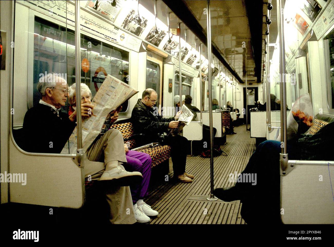 Date of recording: 14.10.1996 Newspaper reading passengers in London ...