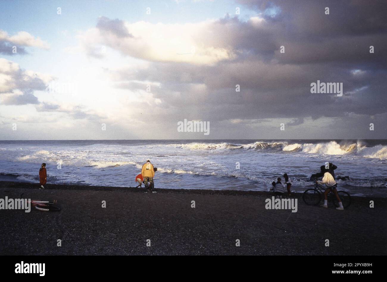 Shellfish hunters in the evening mood on the beach of Maldonado ...