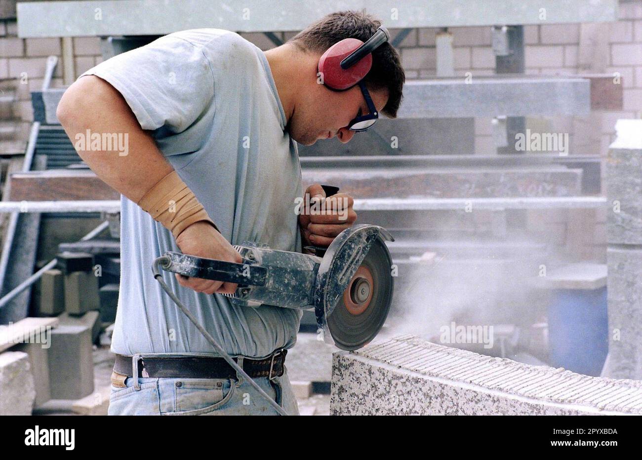 Date of photo: 12.06.1997 Stonemason working on a gravestone in a ...