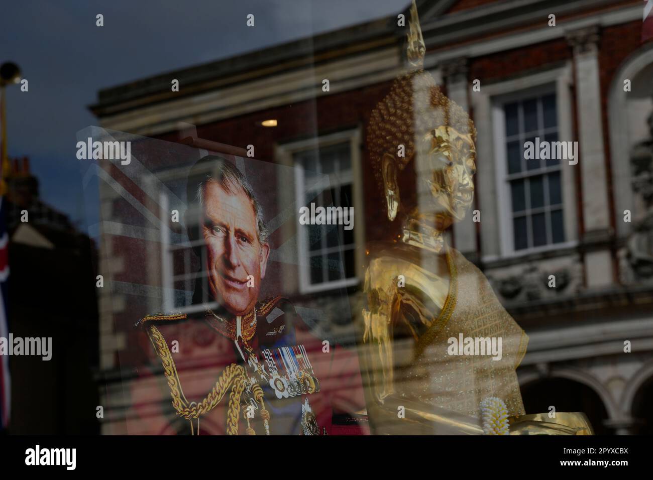 A picture of King Charles III is seen in a shop window in Windsor ...
