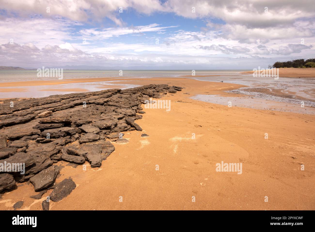 A serene landscape featuring a sandy beach at West Point on Magnetic ...