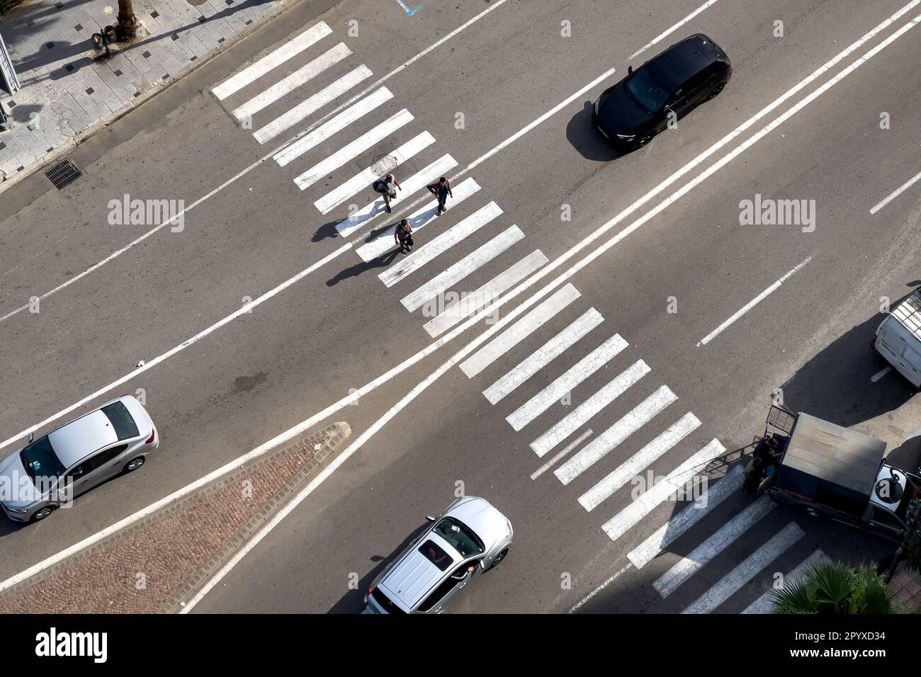 An aerial view of Pedestrians crossing the zebra lines Stock Photo - Alamy