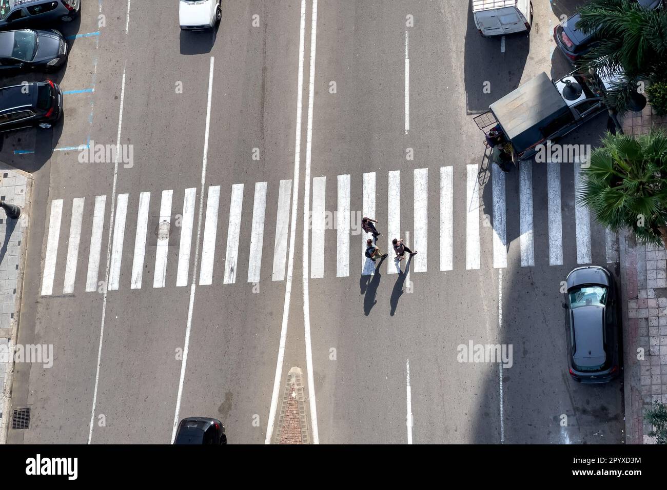 An aerial view of Pedestrians crossing the zebra lines Stock Photo - Alamy